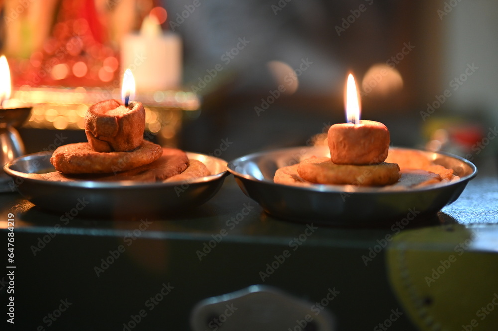 Plate with Indian traditional flapjack and oil lamp from bull Worship ...