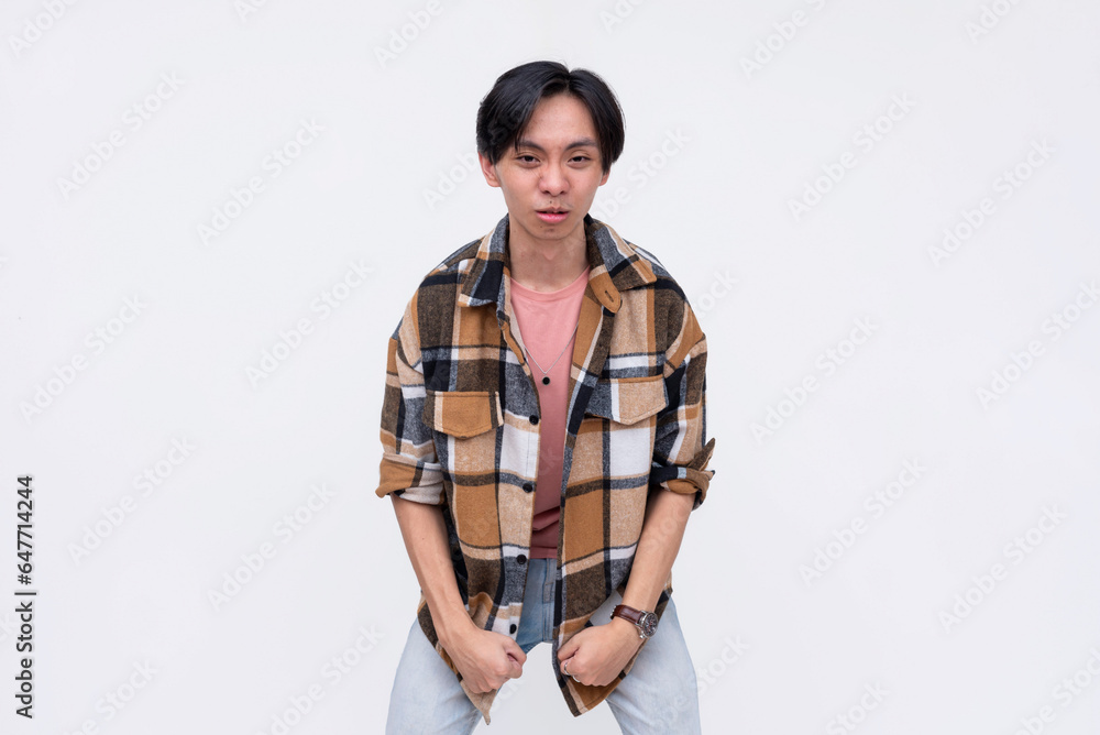 A funny young asian man hulking up with his thin lanky body, pretending ...