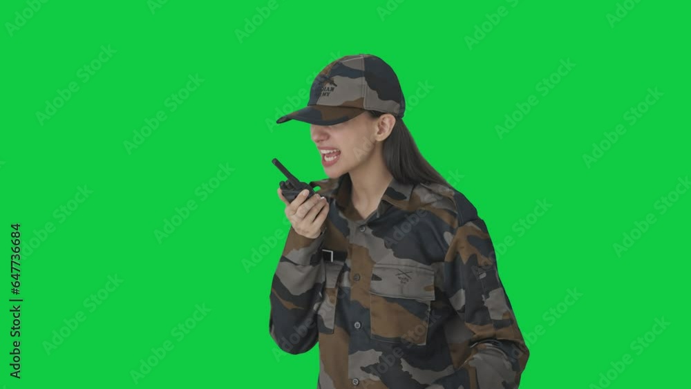 Angry Indian woman army officer shouting on walkie talkie Green screen ...