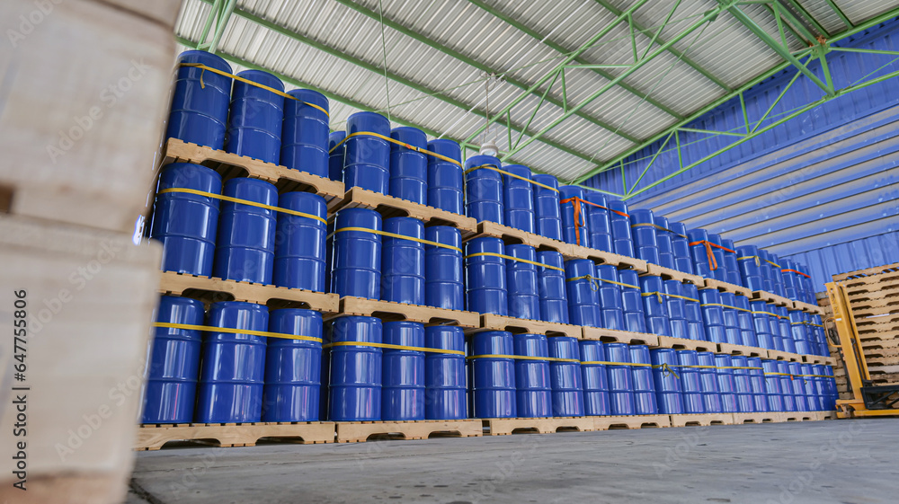 Chemical storage tanks neatly stored on wooden pallets in Warehouse ...