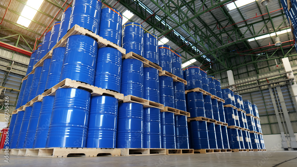 Chemical storage tanks neatly stored on wooden pallets in Warehouse ...