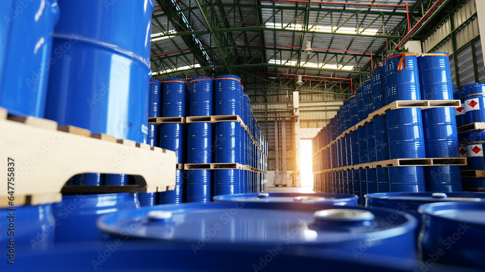 Chemical storage tanks neatly stored on wooden pallets in Warehouse ...