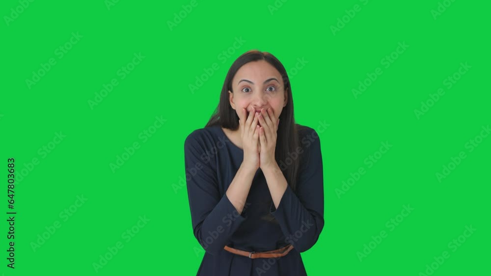 Happy Indian girl getting a surprise Green screen Stock Video | Adobe Stock