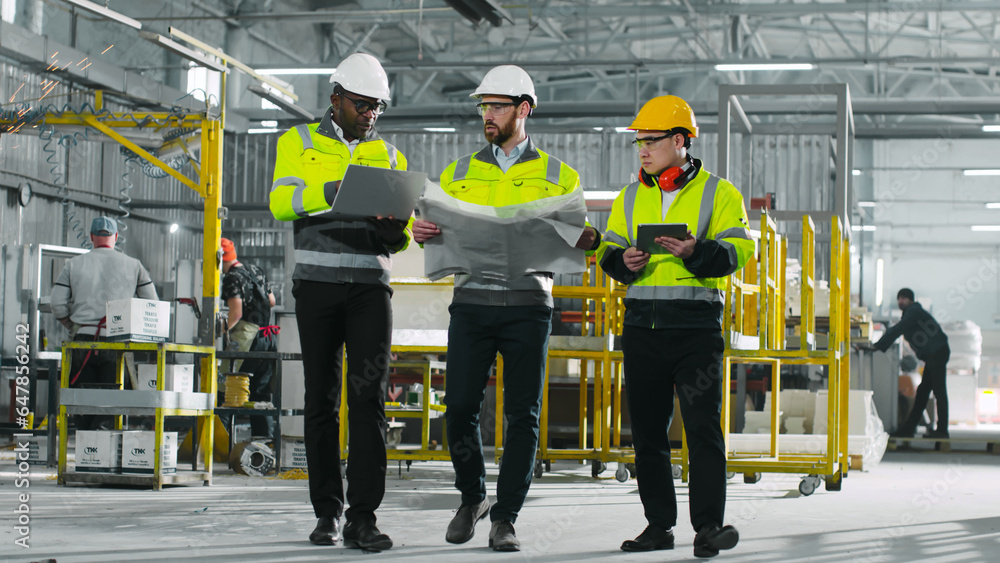 Tree construction workers. Men in special uniforms and helmets move in ...