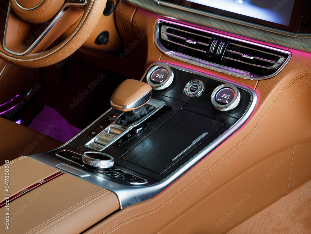 Foto de Orange luxury car cockpit with exclusive wood and metal ...