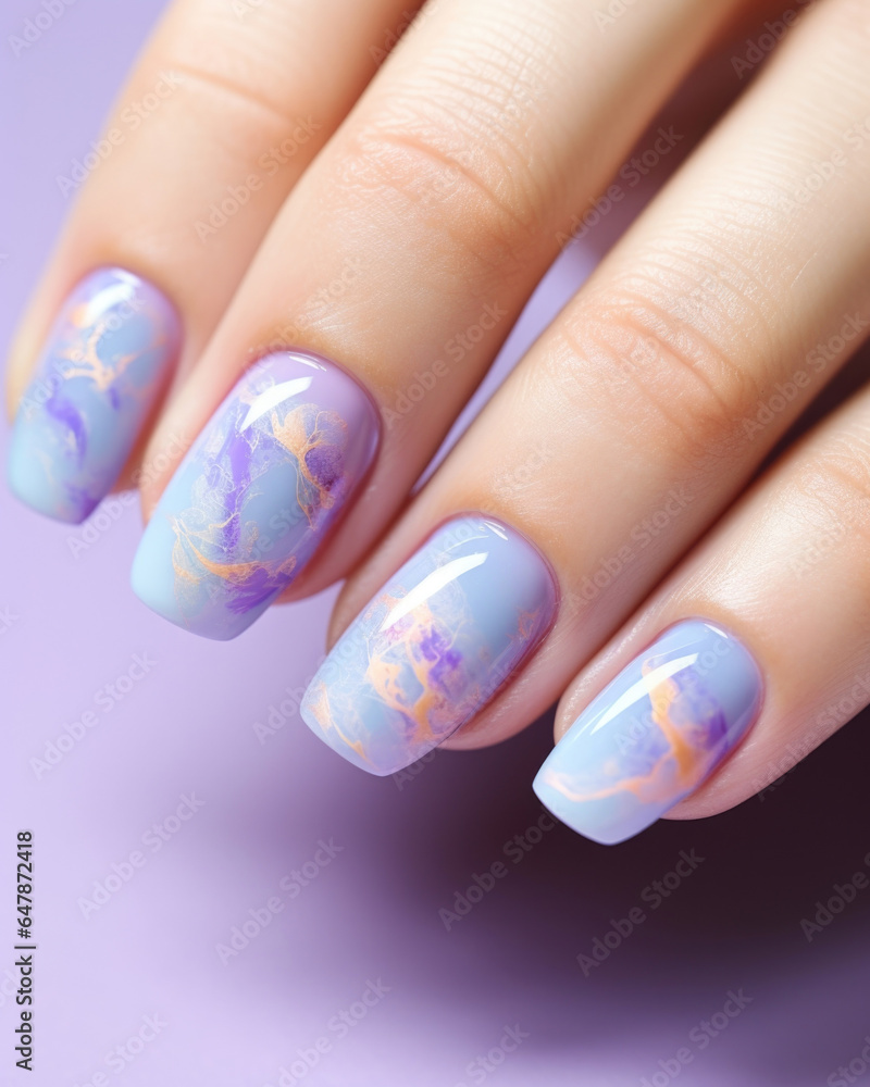 An ethereal and dreamy nail design that showcases a delicate marbled ...
