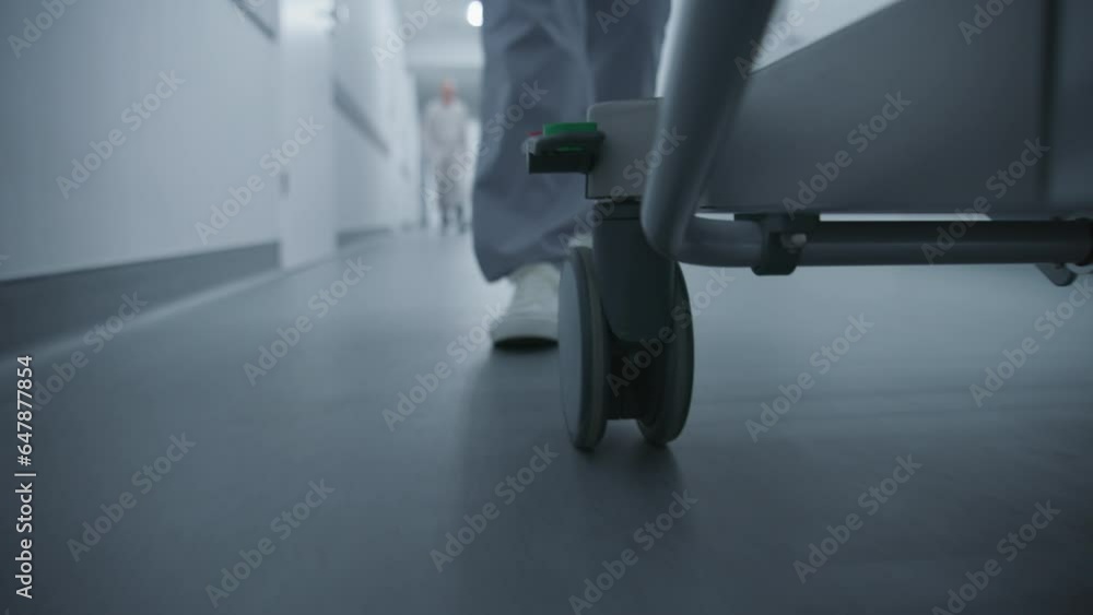 Doctor, nurse or paramedic move gurney with seriously injured patient ...