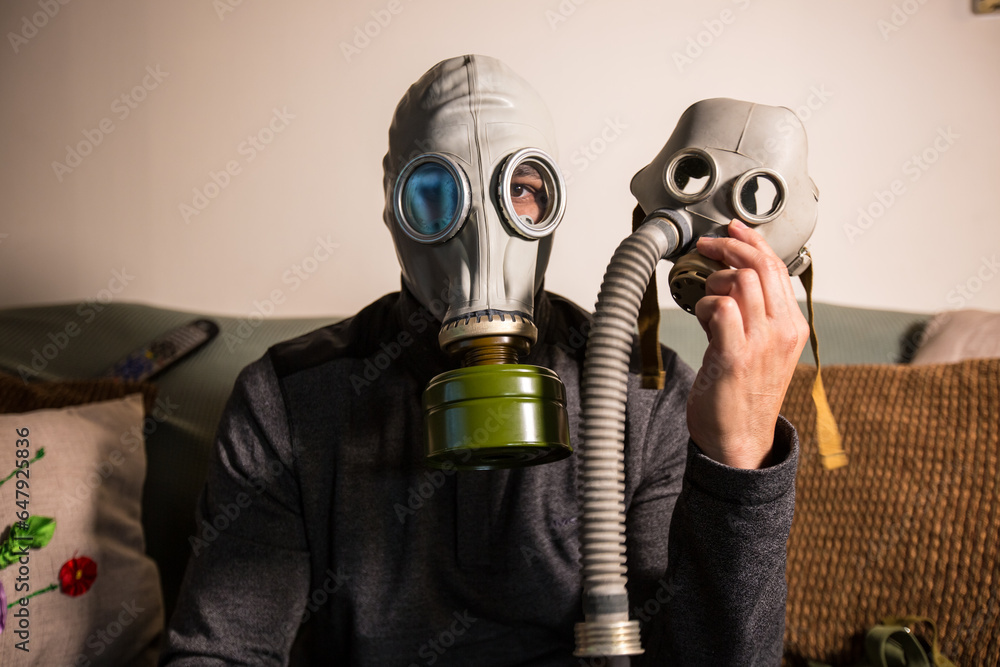 Civilian wearing nuclear gas mask during nuclear fallout and a time of ...