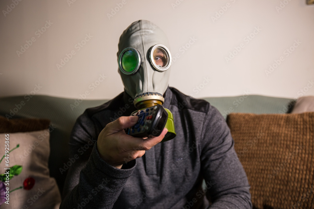 Civilian wearing nuclear gas mask during nuclear fallout and a time of ...