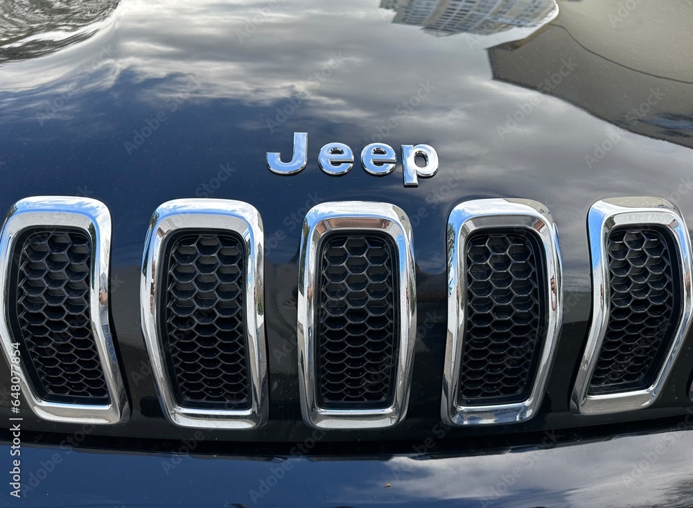 JEEP logo on a black SUV. Chromed Jeep company emblem on the car Stock ...