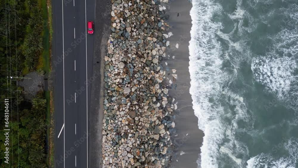 Bruce Bay, New Zealand: top down drone footage of coastal road and ...