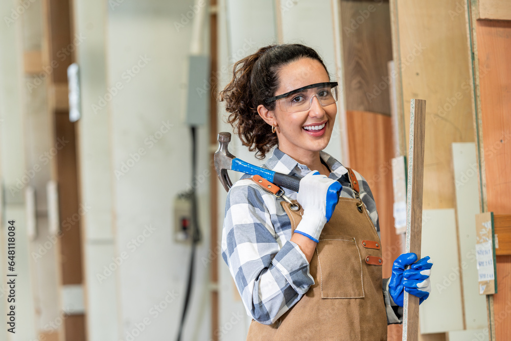 One Strong confident young aged women carpenter standing look at camera ...