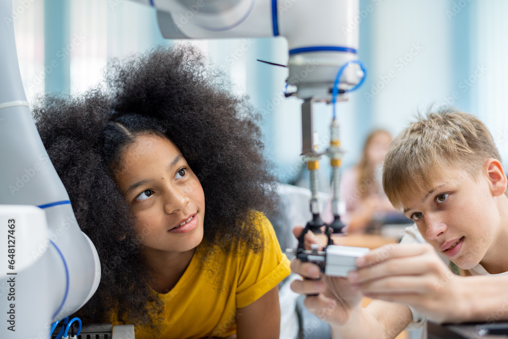 Group Kid teen child enjoy Machine Learning Robot arm is Moving Under ...