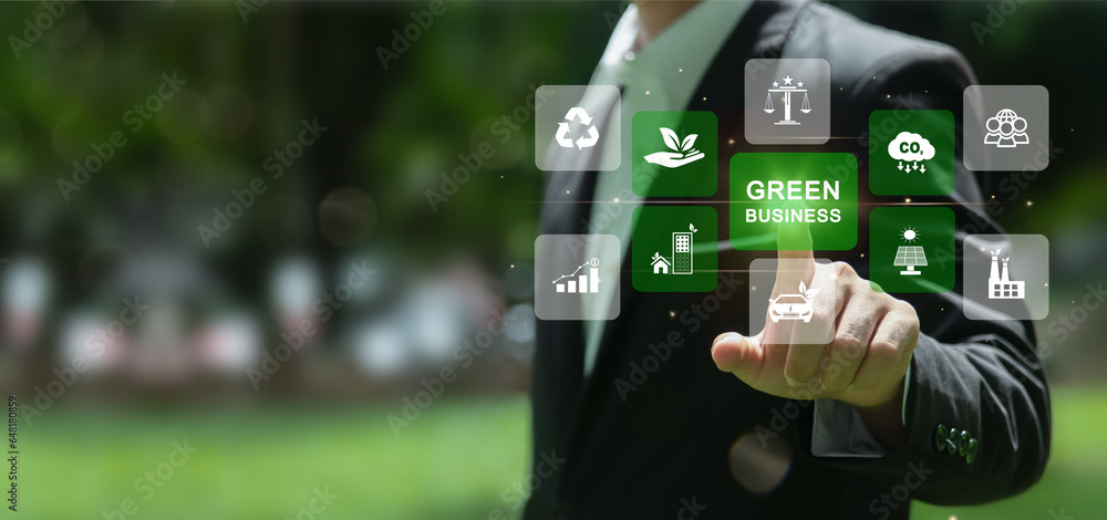 Businessman touching on words green business and analyze sustainability ...