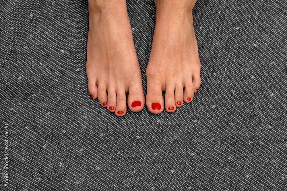 When passion passes through the foot. Feet of a young girl with fiery ...