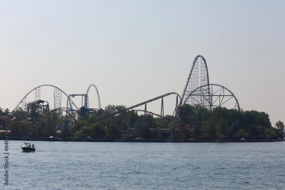 Rollercoasters and thrill rides at the a amusement park in summer ...