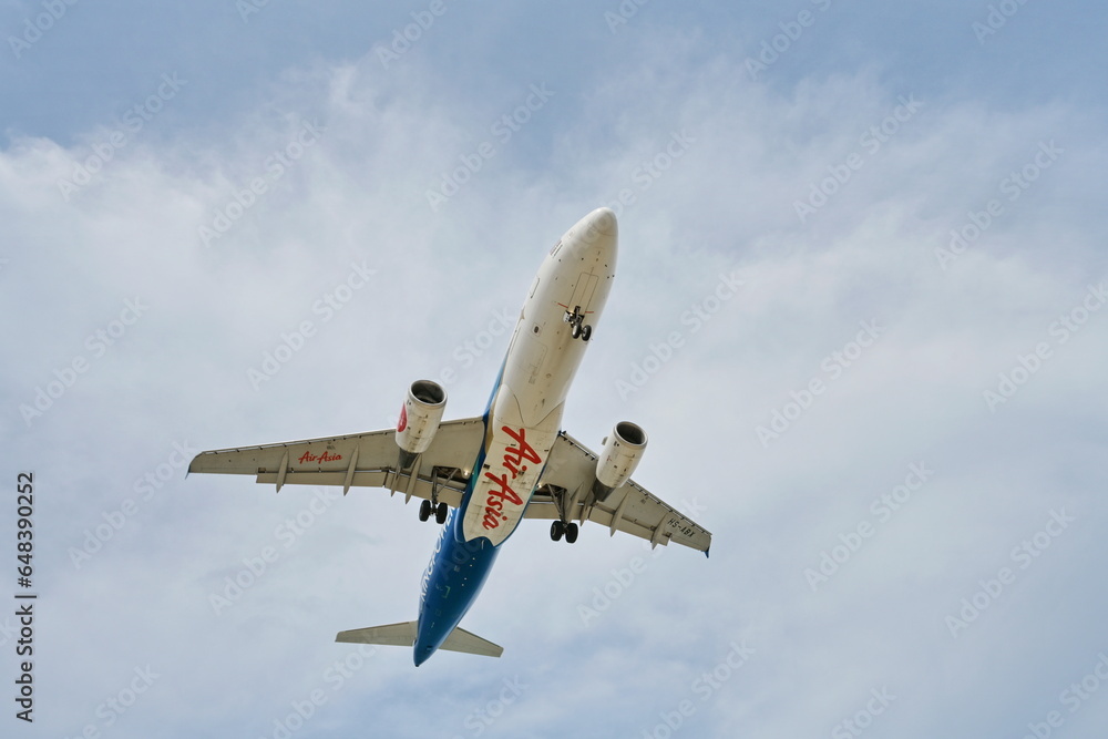 AirAsia plane landing above the beach at Phuket Airport (HKT). AirAsia ...