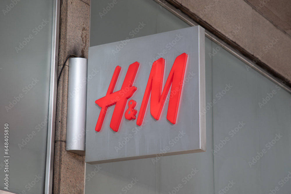 H&M sign logo and text brand front of facade store chain fashion ...