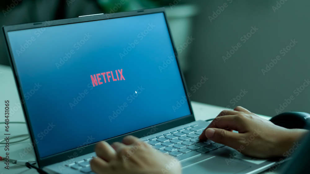 LAMPHUN, THAILAND - September 15, 2023: Woman using a laptop and ...