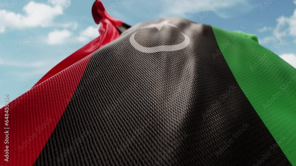 Wavy flag of Libya blowing in the wind in slow motion. Waving colorful ...