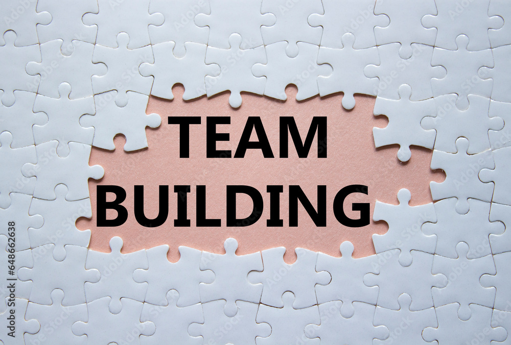 Team Building symbol. Concept word Team Building on white puzzle ...