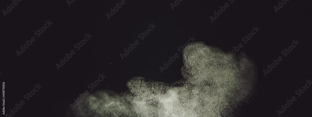 Vidéo Stock Dust Particles Flying In The Wind on the black background ...