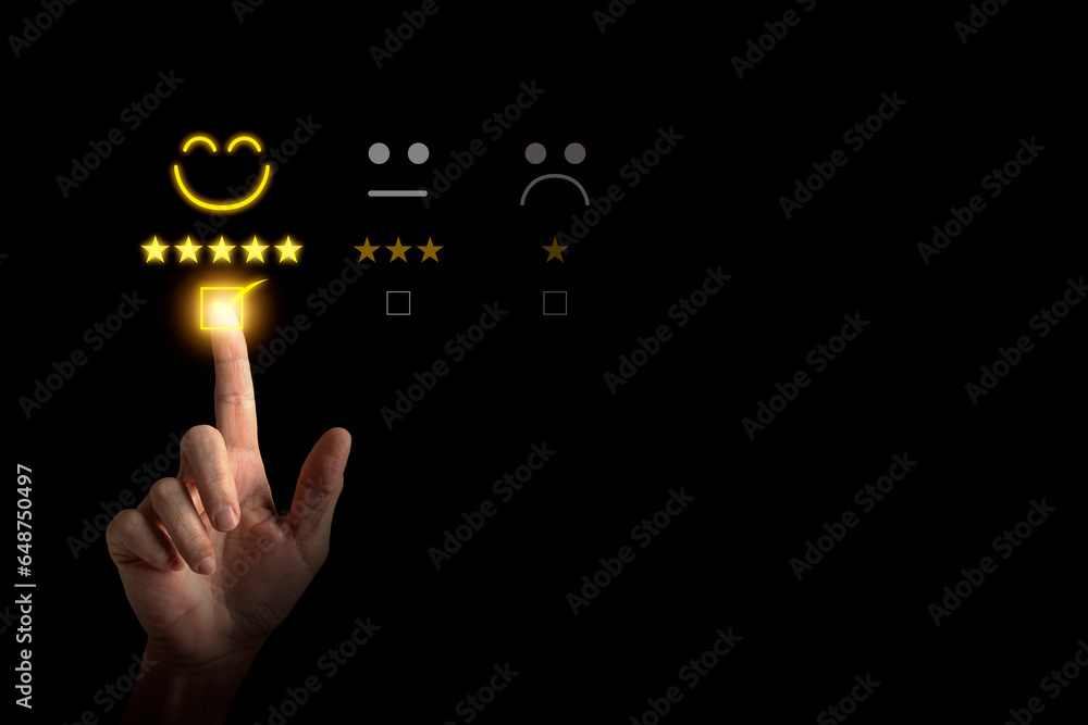 Satisfaction survey concept ,Man hand press the smiling face emoticon ...