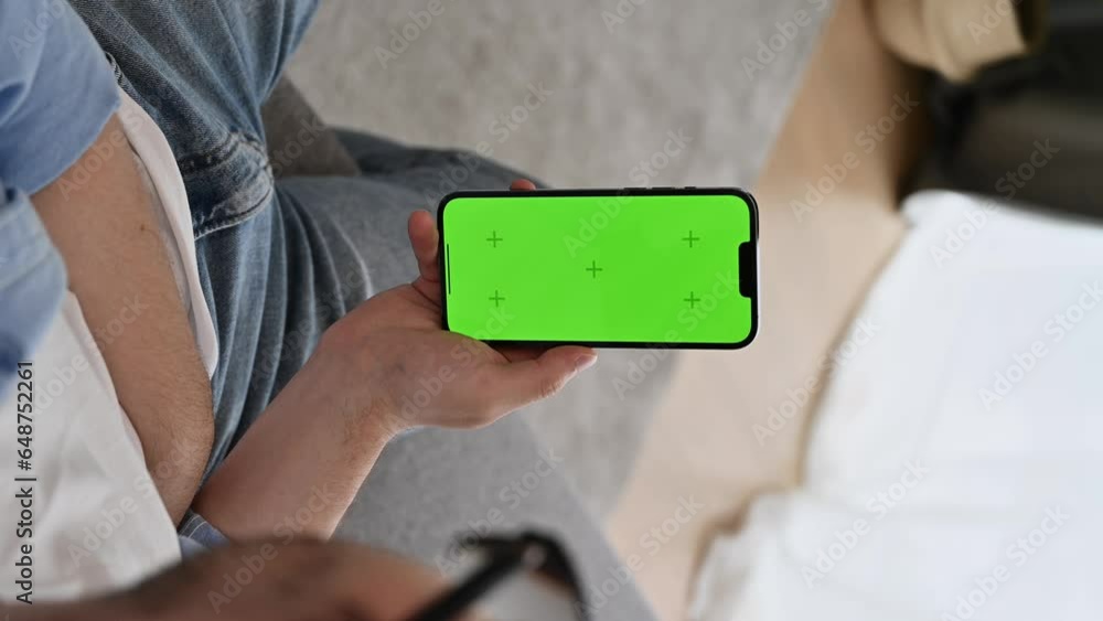 Vertical footage of man scrolling through social media,streaming ...