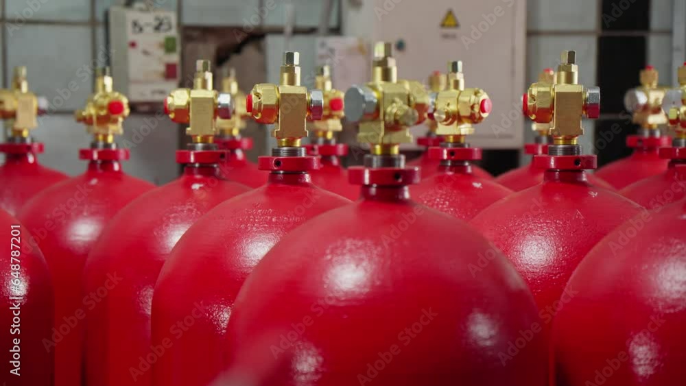 Rows of red fire extinguishers. Fire prevention. Fire extinguishers to ...