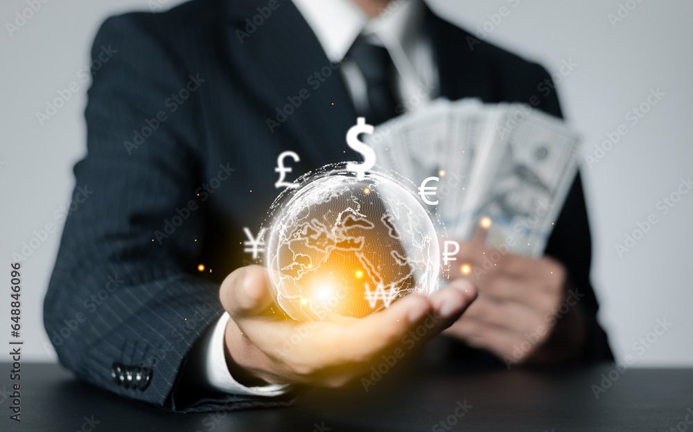 Foreign currency exchange concept. Businessman holding world with ...