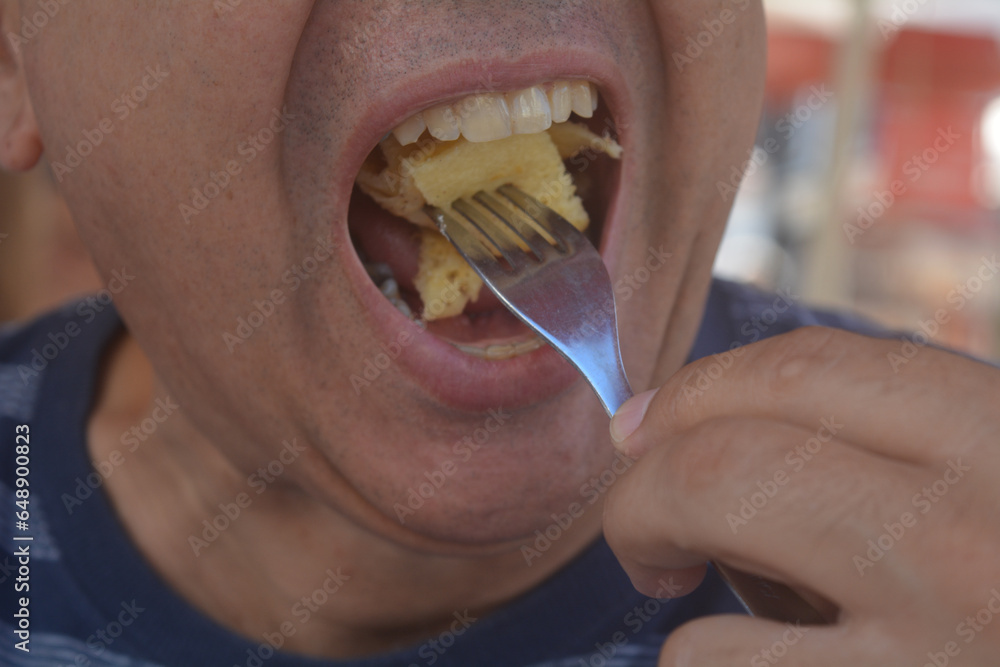 man eating with his mouth open, fork putting food in his mouth Stock ...