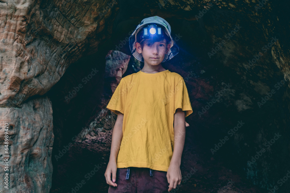 Happy face exploring cave architecture. Solo adventure connecting with ...