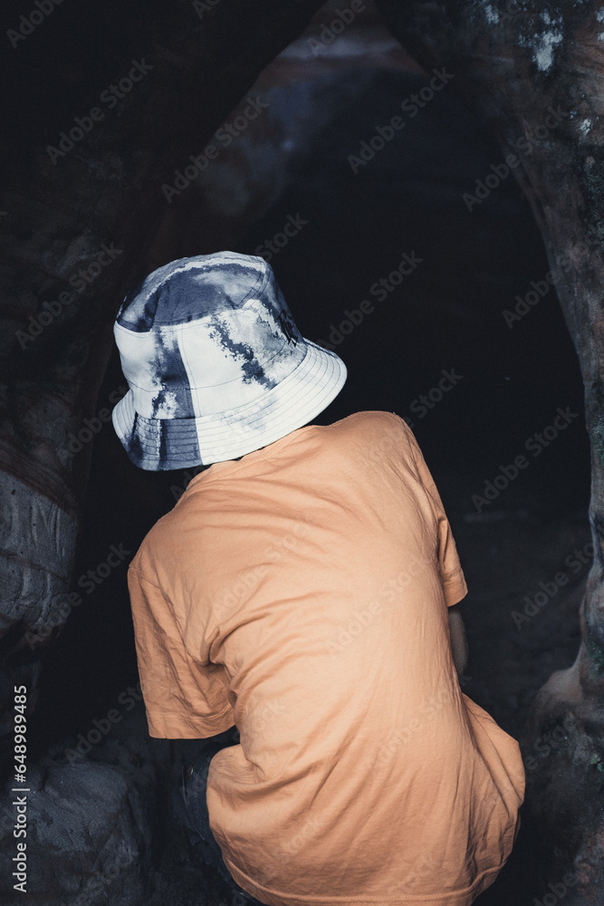 Happy face exploring cave architecture. Solo adventure connecting with ...