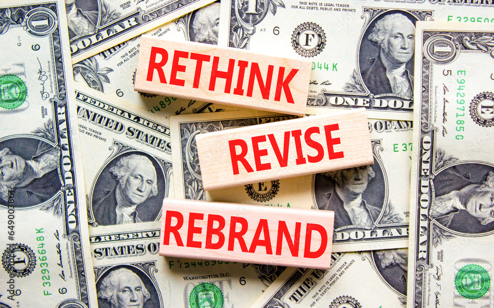 Rethink revise rebrand symbol. Concept word Rethink Revise Rebrand on block. Dollar bills ...