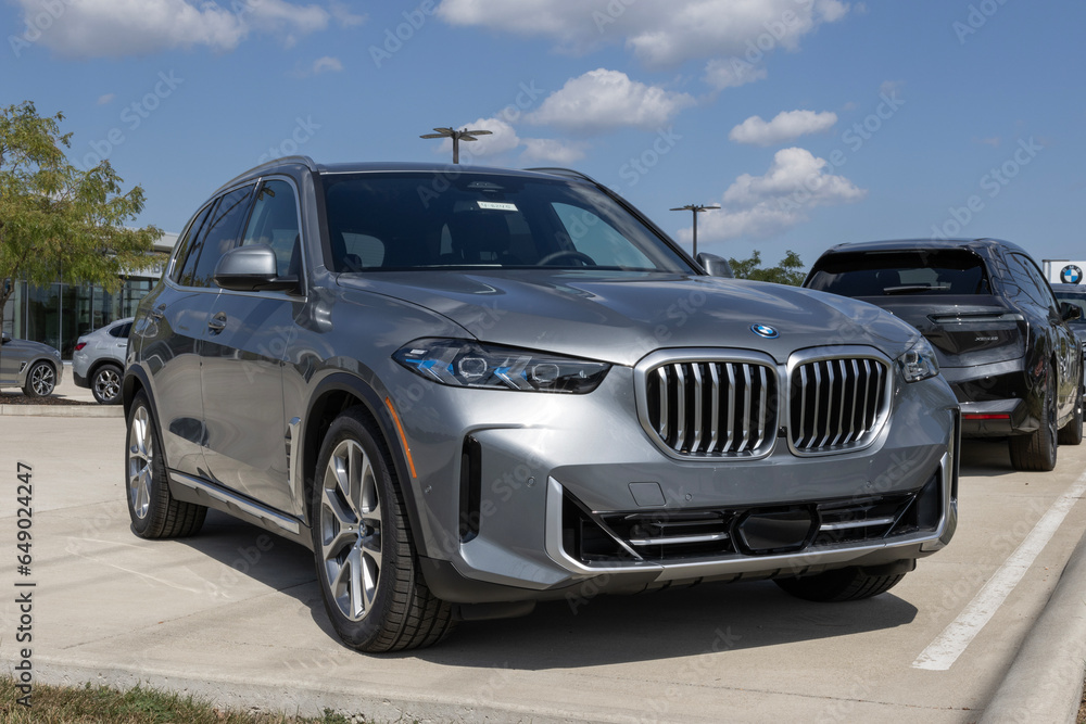 BMW X5 xDrive50e Plug-In Hybrid SUV display at a dealership. BMW offers ...