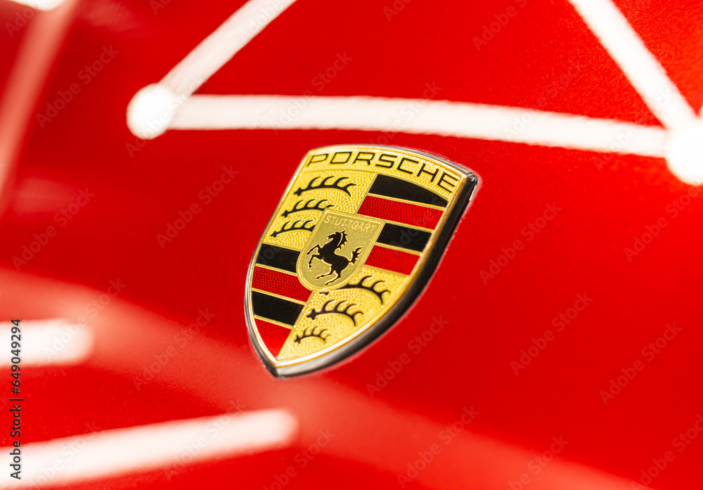 Logo of car Porsche on red background view from above. The logo on the ...