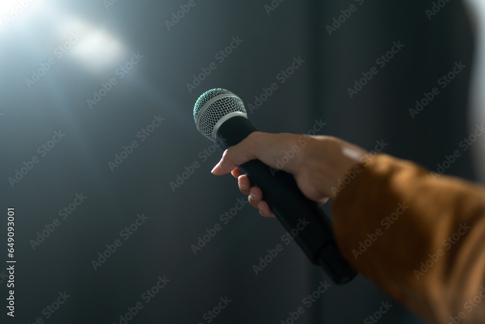 Close up woman hand holding High quality dynamic microphone and singing ...