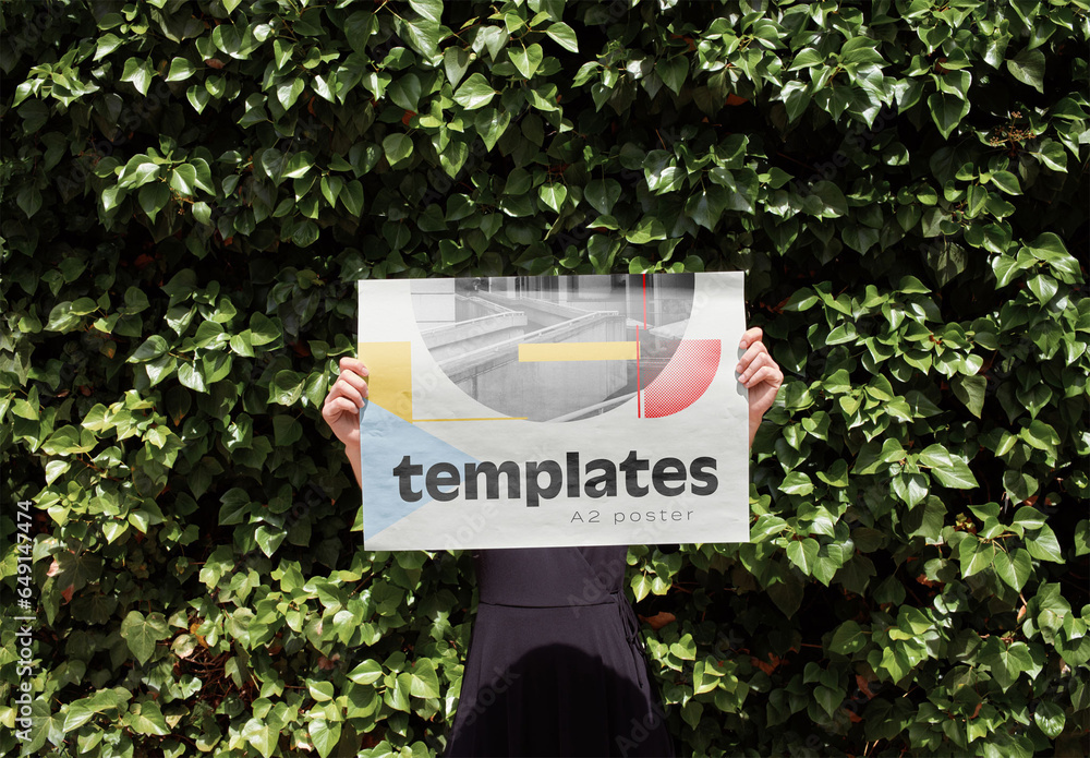 Mockup of person holding customizable A2 horizontal poster in front of ...