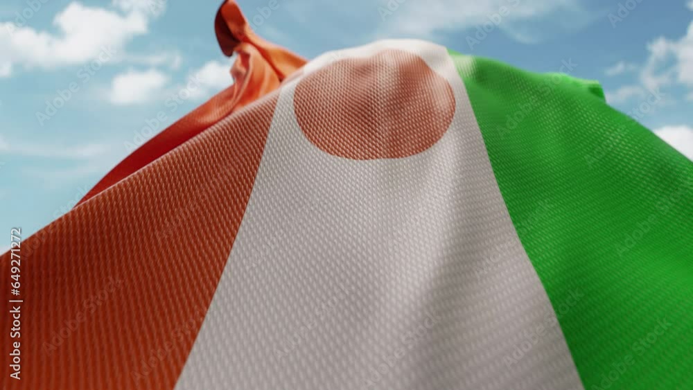 Wavy flag of Niger blowing in the wind in slow motion. Waving official ...