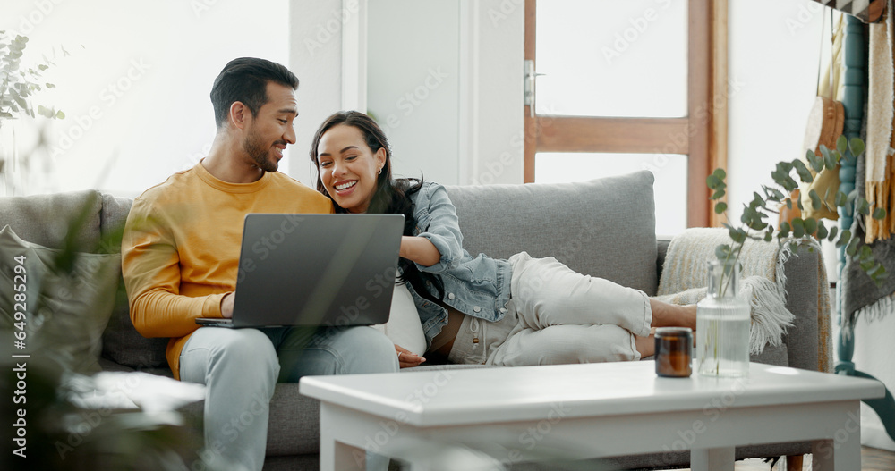 Couple, laptop and laugh on sofa in home for meme, watch movies and ...