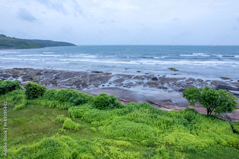 Foto de Aerial footage of Ladghar beach at Dapoli, located 200 kms from ...