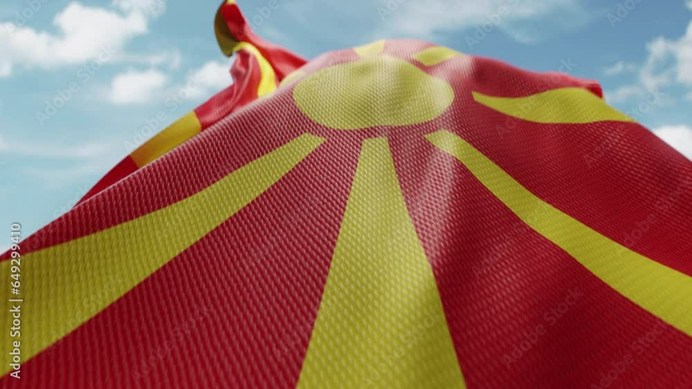 Wavy flag of North Macedonia blowing in the wind in slow motion. Waving ...