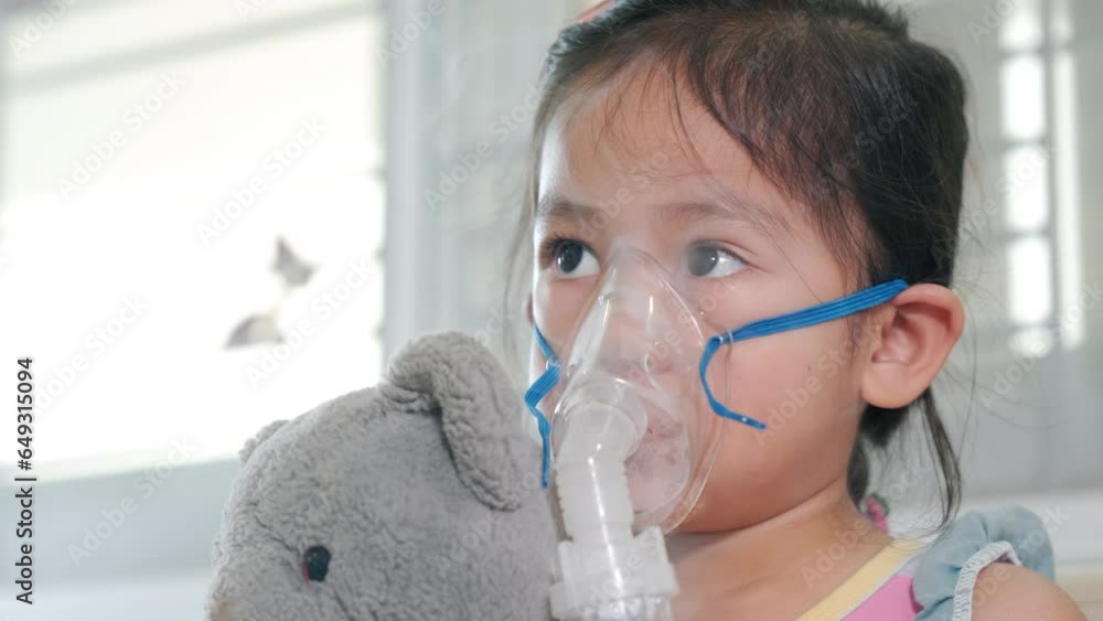 Kid girl making makes inhalation nebulizer steam sick cough at home ...