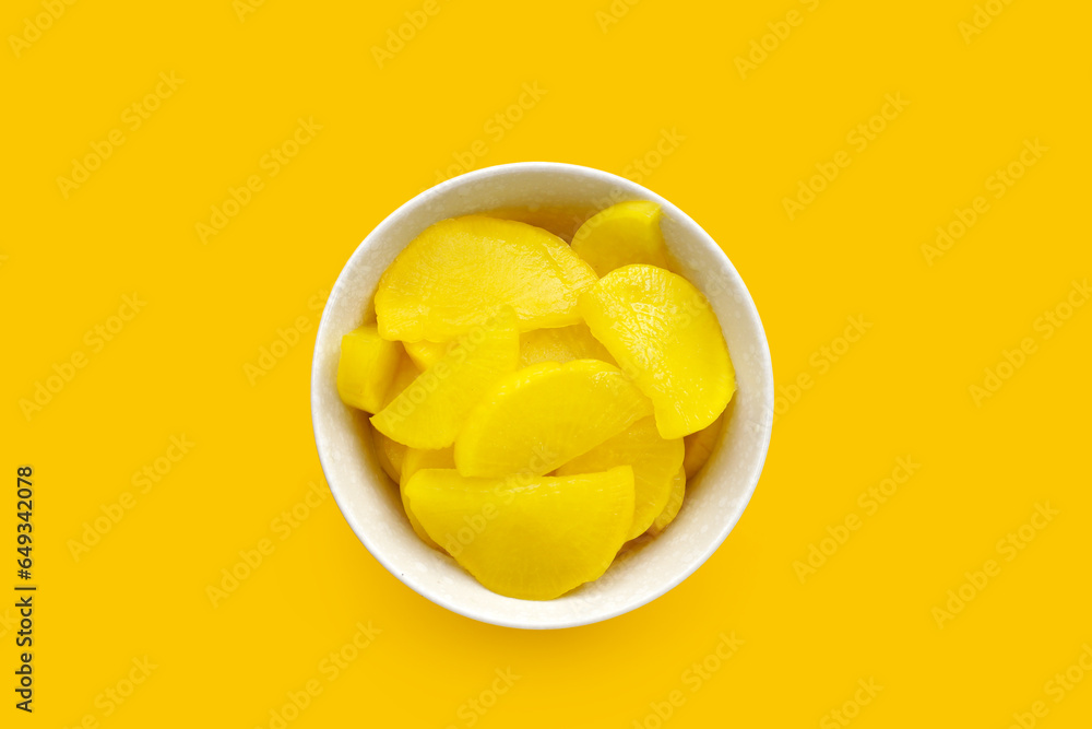 Sweet and tart slices of yellow pickled daikon, known as takuan in ...