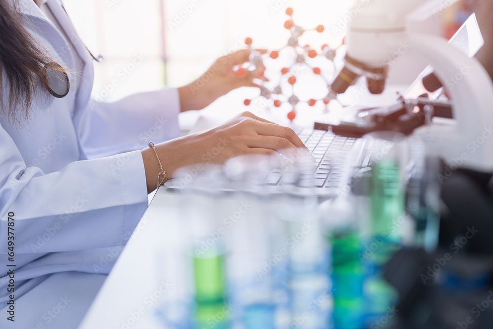 Scientist working in advance science lab using super computer ...