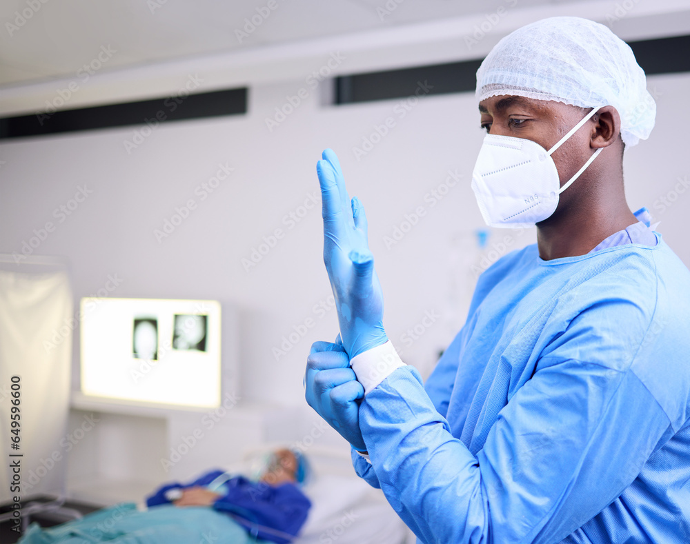 Doctor, man and surgery, put glove on hand and start operation with ...
