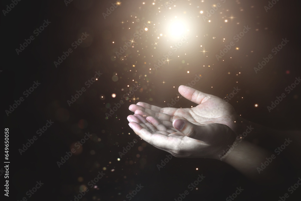 Praying hands of men with light shining from above. concept of prayer ...