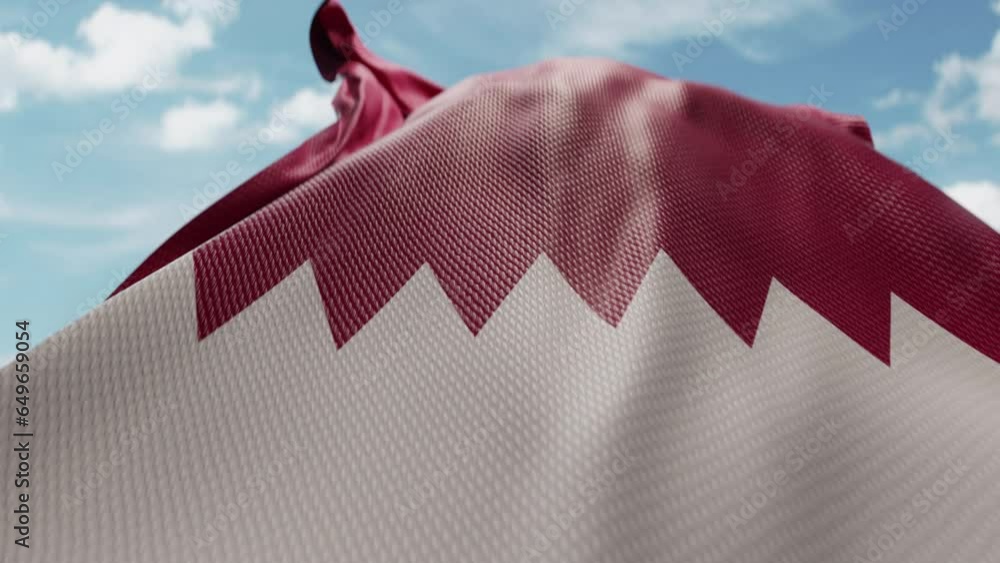 Wavy flag of Qatar blowing in the wind in slow motion. Waving official ...