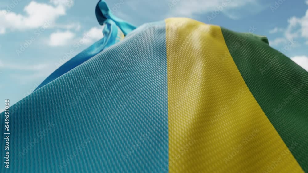 Wavy flag of Rwanda blowing in the wind in slow motion. Waving official ...