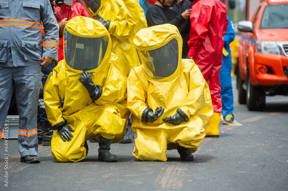 Rescue workers were wearing yellow hazmat suits with oxygen tanks ...